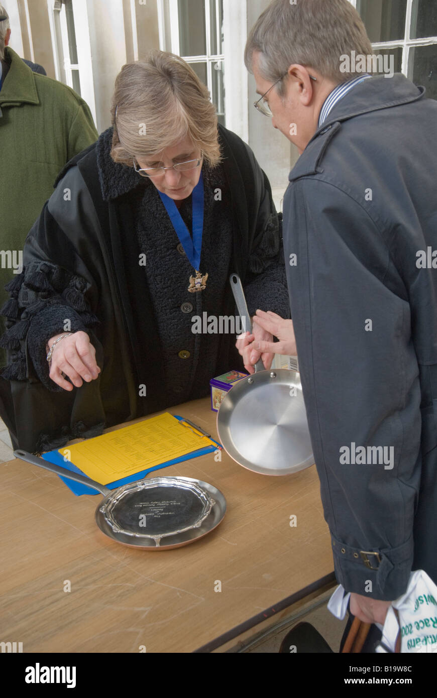 Looking at the trophy for the Poulters' Company Shrove Tuesday Pancake ...