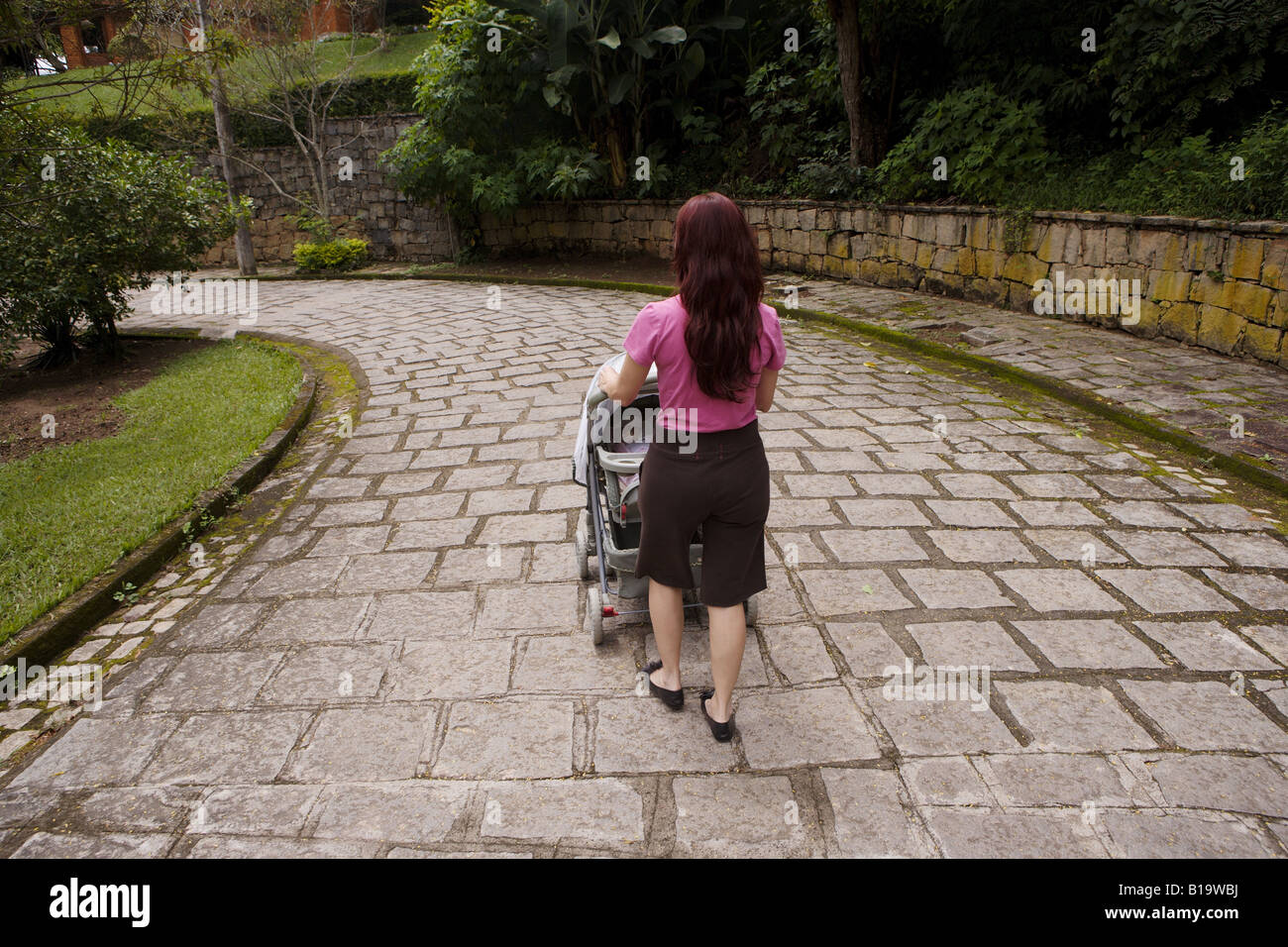 mother pushing a baby cart Stock Photo - Alamy