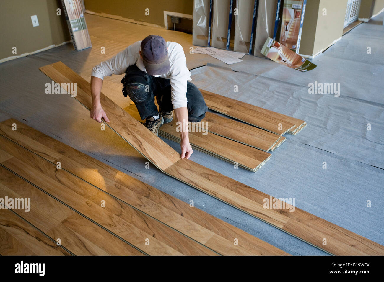 Man renovating the floor Stock Photo - Alamy