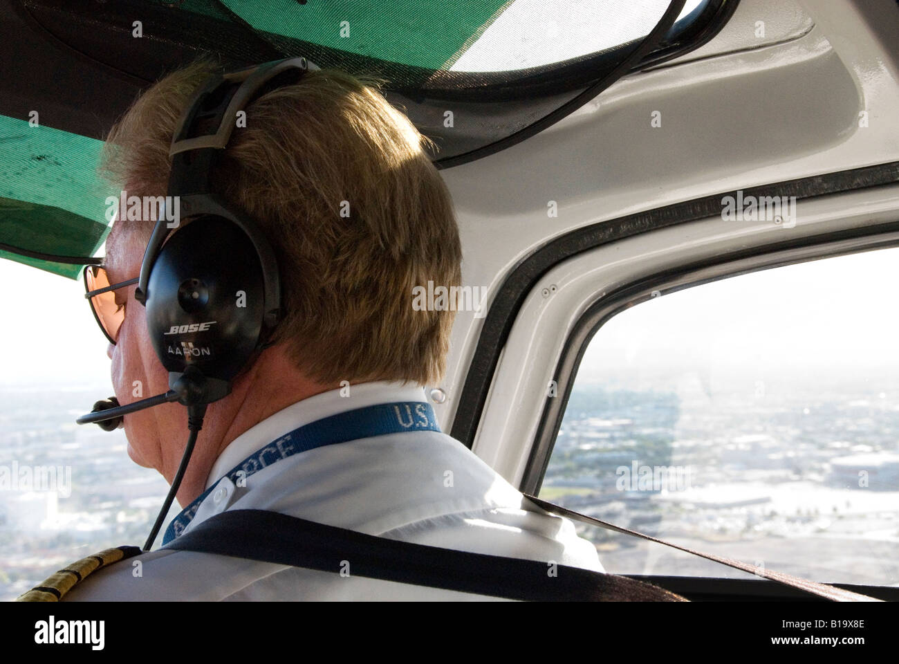 Helicopter pilot in flight Stock Photo - Alamy