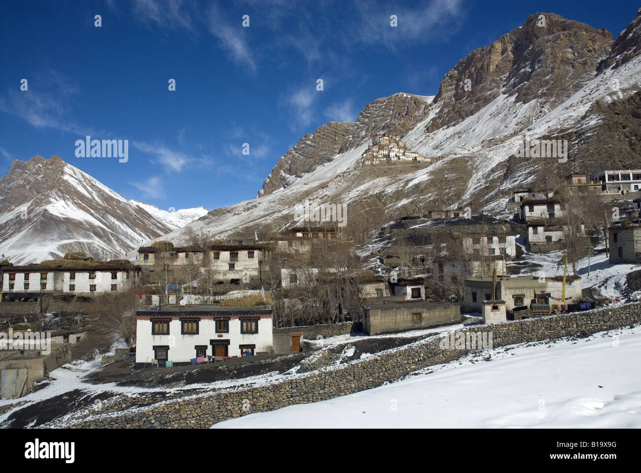 Snow covered Ki village with Ki monastery in the background. At a ...