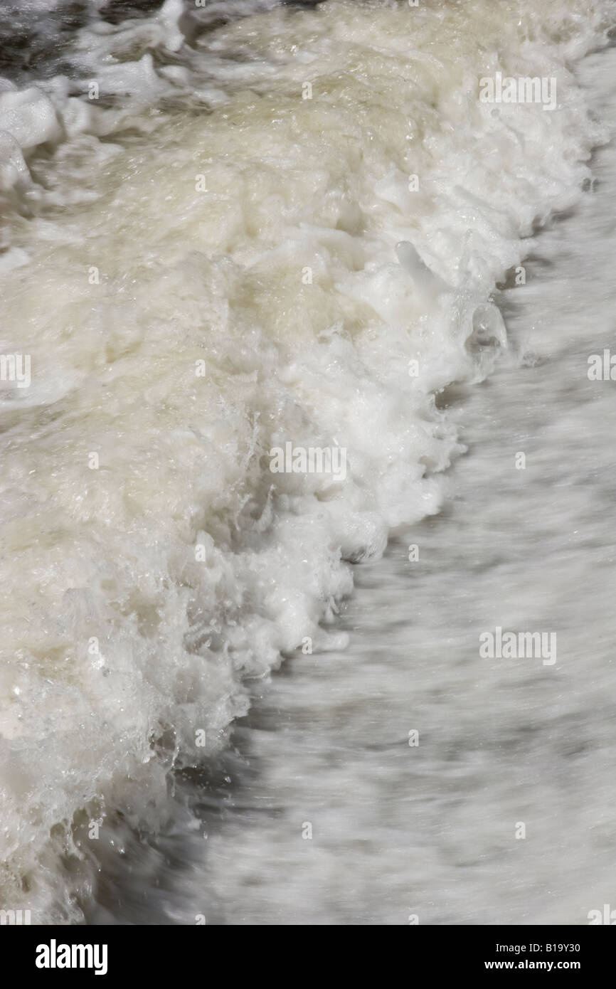 Standing wave produced by water rushing over a weir Stock Photo - Alamy