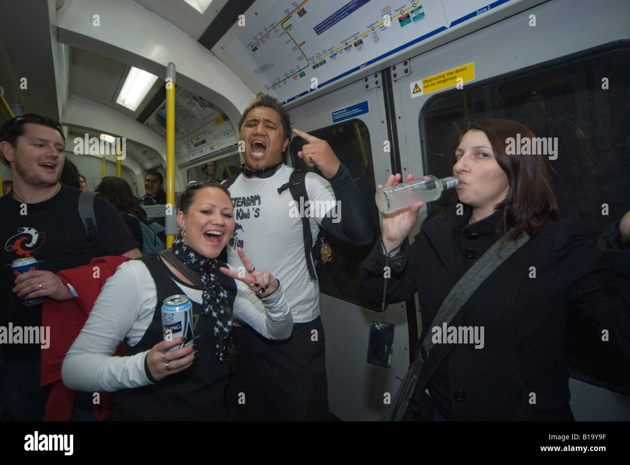 New Zealanders partying in an underground train carriage during the ...
