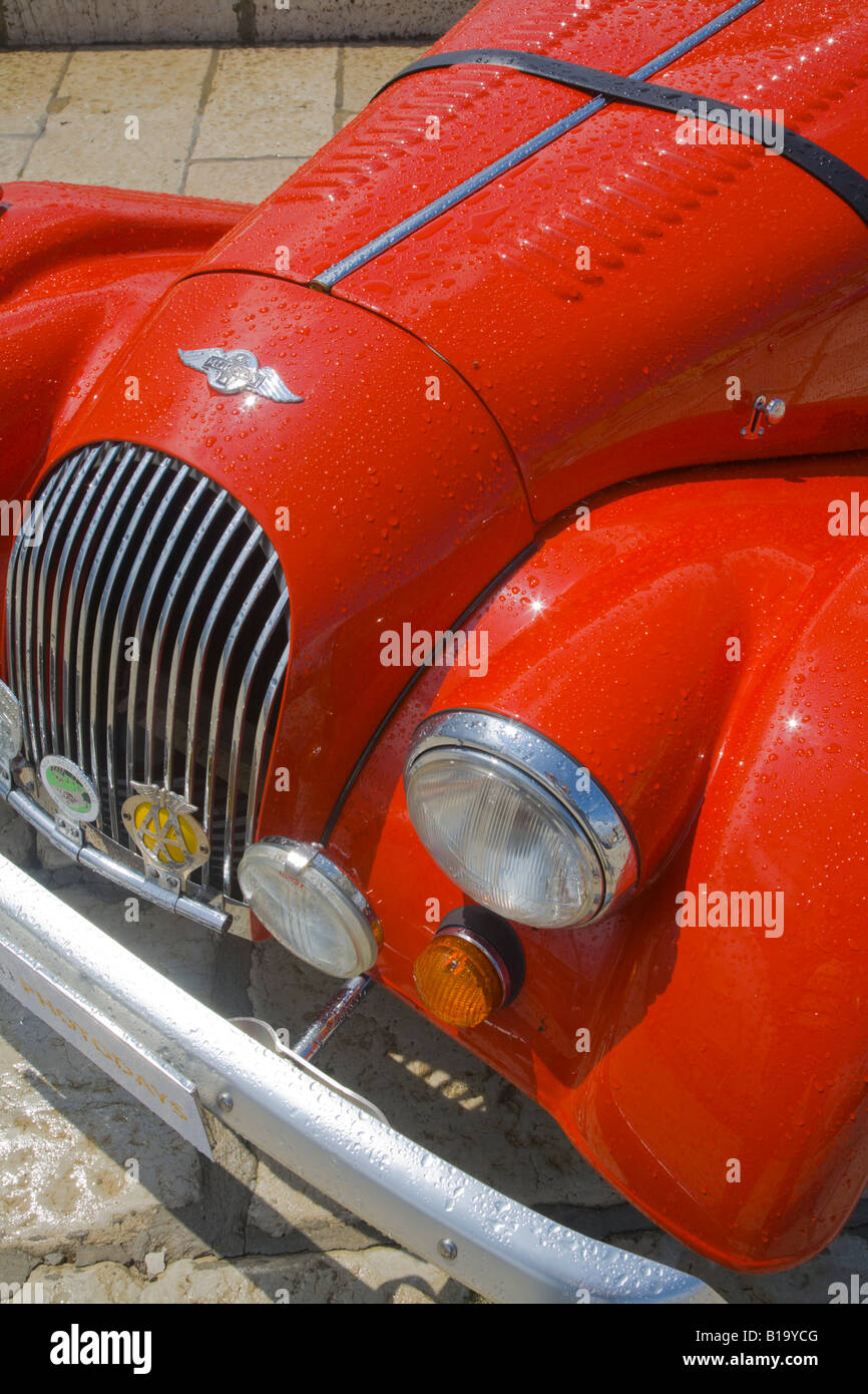 Wet Red car surface after rain Stock Photo - Alamy