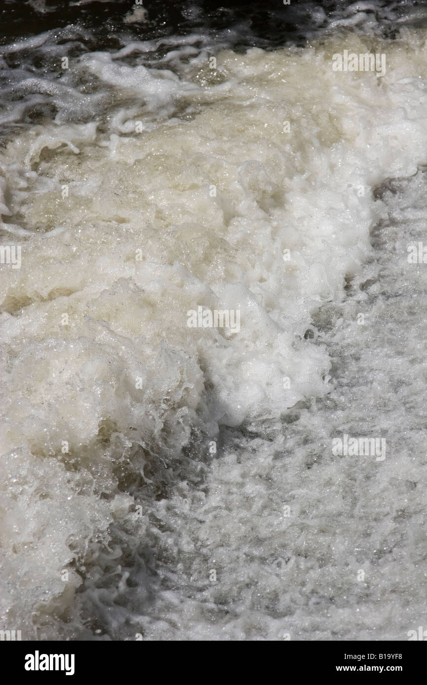 Standing wave produced by water rushing over a weir Stock Photo - Alamy
