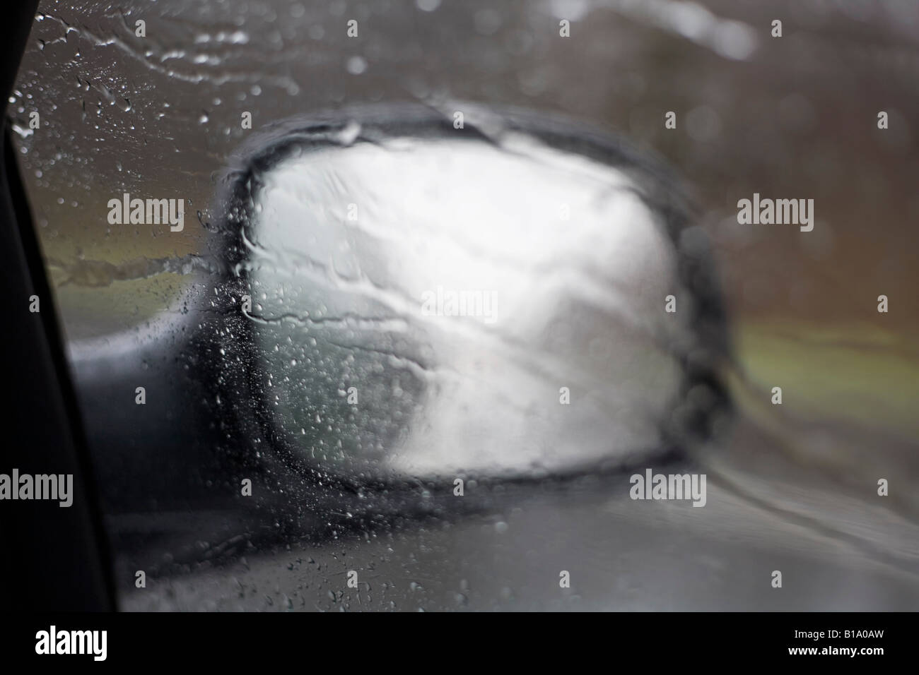 wet window and side mirror Stock Photo - Alamy