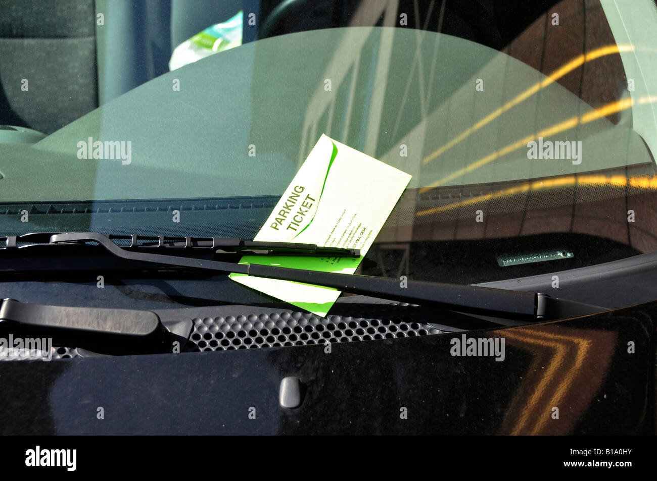 Parking ticket on the windshield of a car Stock Photo - Alamy