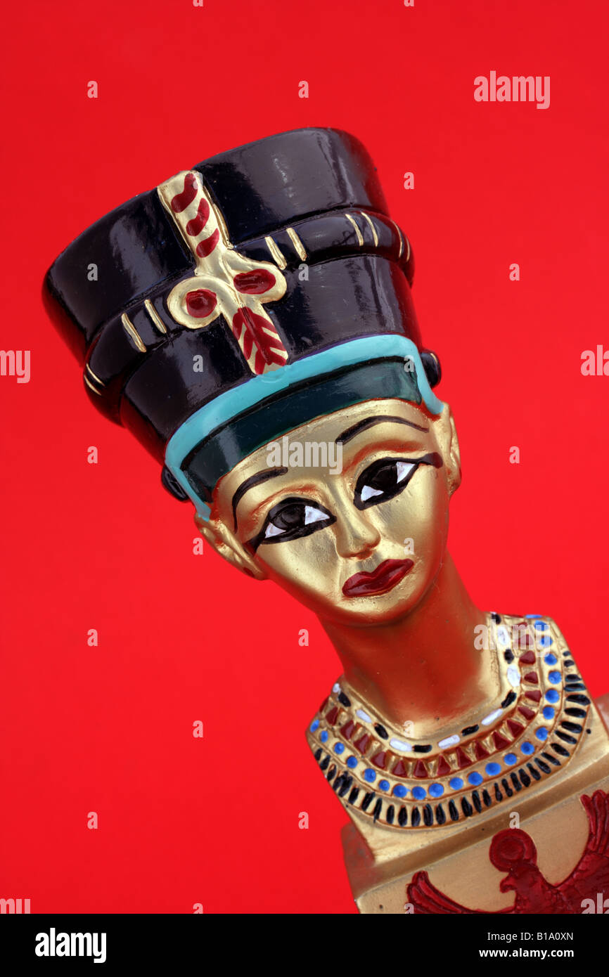 STATUE OF NEFERTITI RED BACKGROUND VERTICAL ANGLED BDB10081 Stock Photo ...