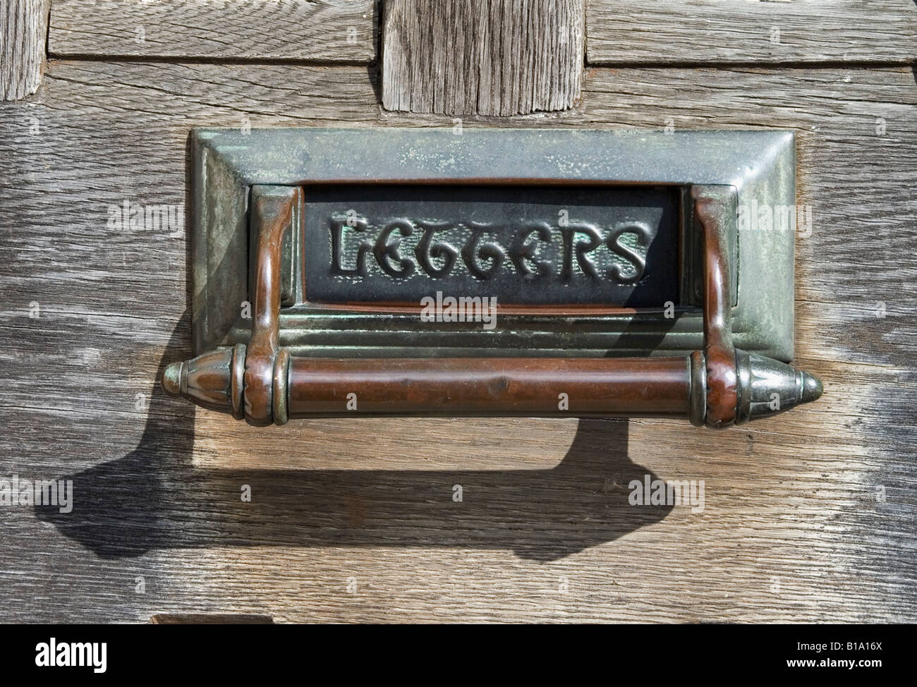 Letter boxes. A hole in the door. 'What could be simpler?' Stock Photo ...