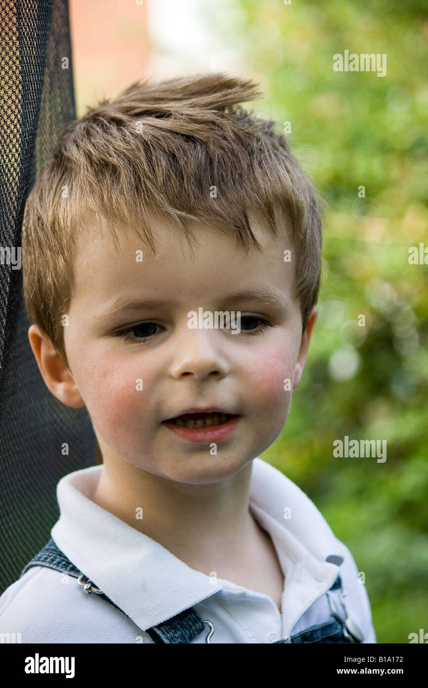 Head and shoulder portrait of happy young boy in his garden Stock Photo ...