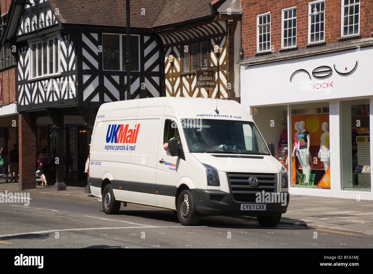 England UK. UKMail white delivery van in city centre with shops Front ...