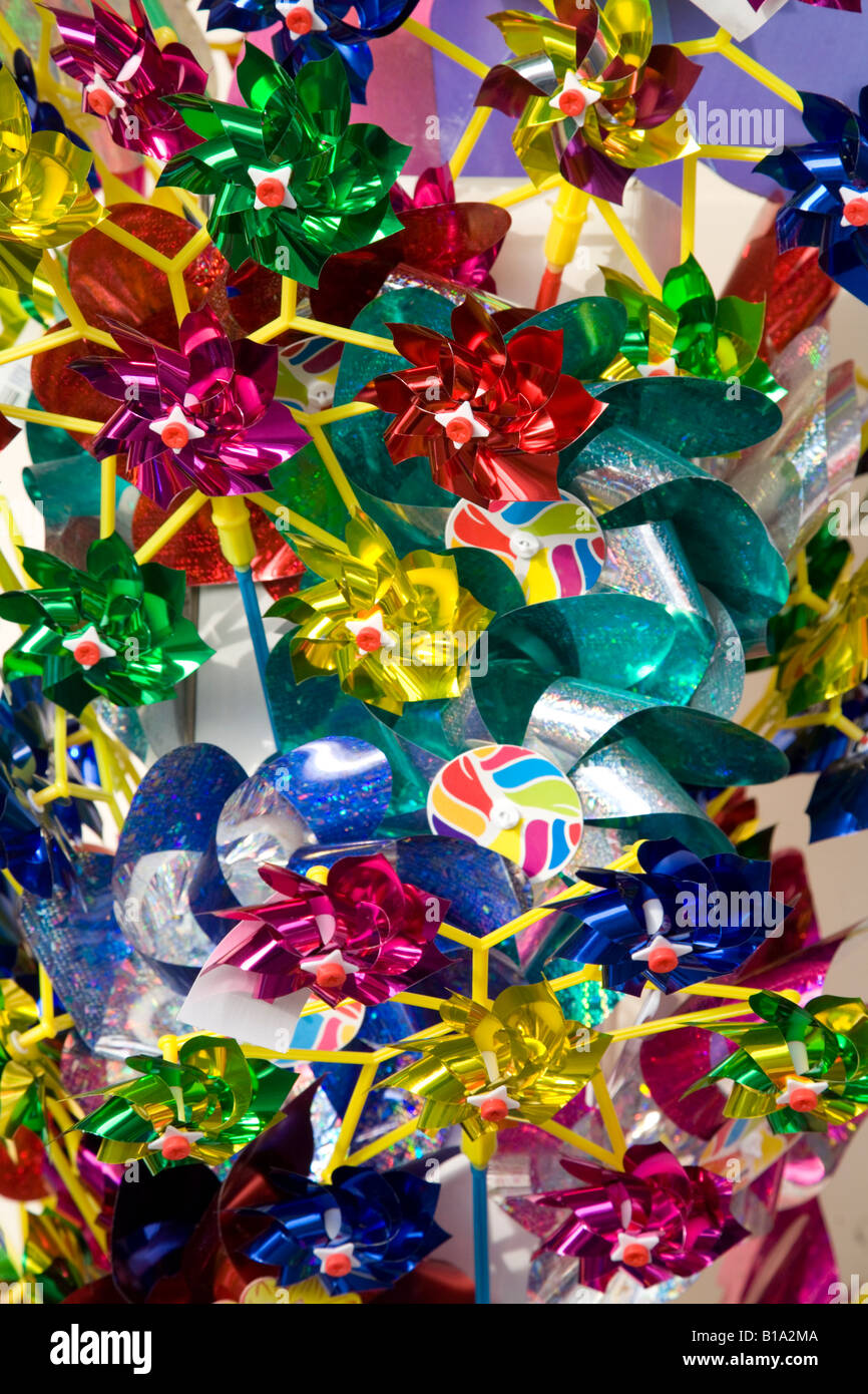 coloured beach toy windmills Stock Photo - Alamy