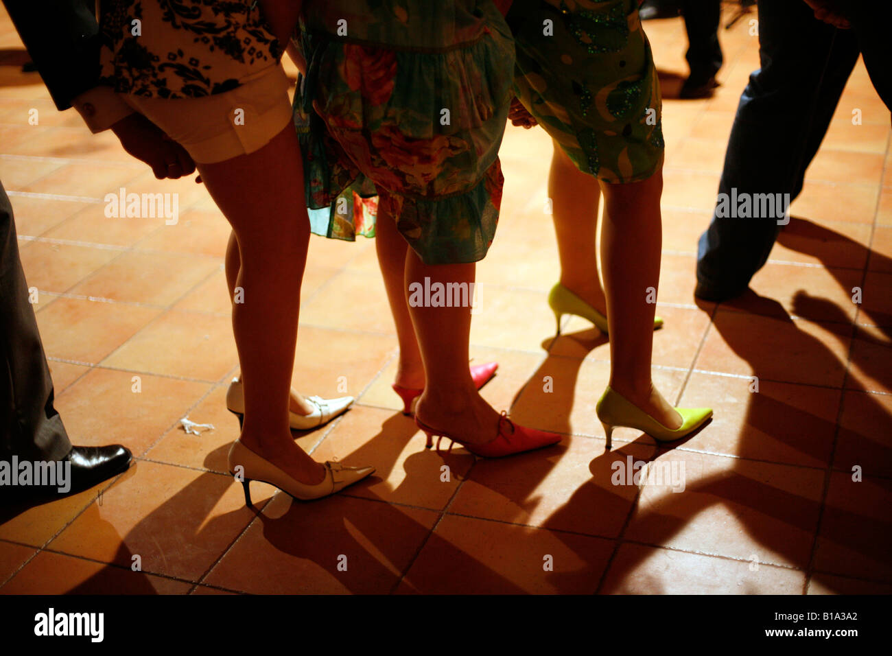 Feminine legs of guests dancing at a wedding reception, Seville, Spain ...