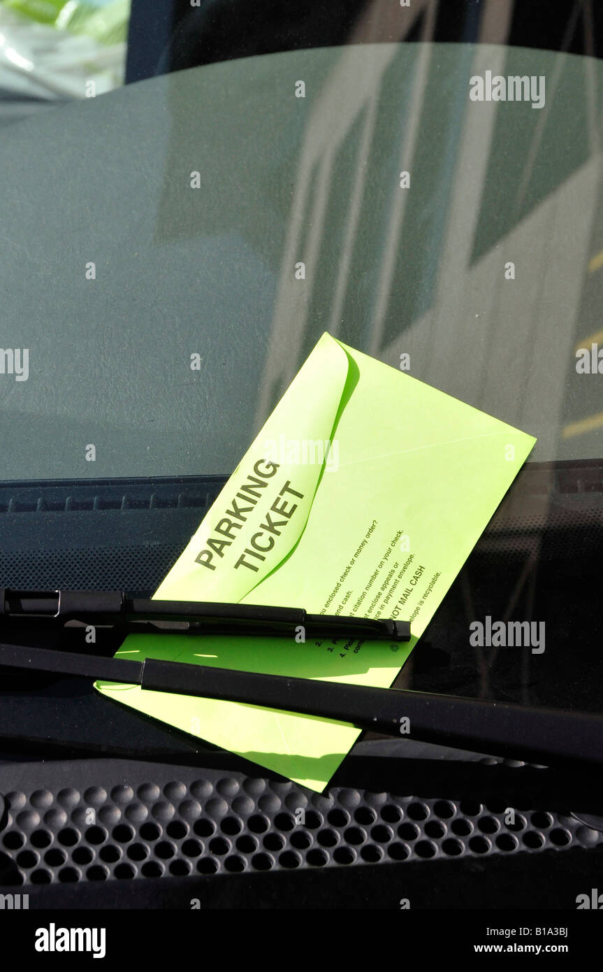 Parking ticket on the windshield of a car Stock Photo - Alamy