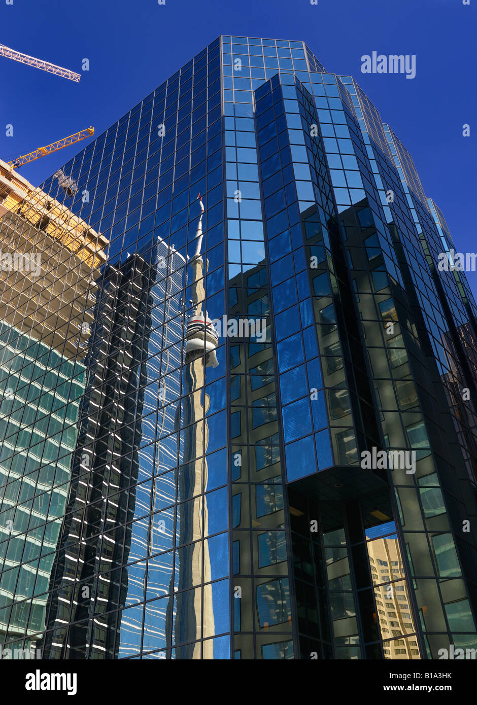 Cluster of blue Toronto highrise towers with CN tower reflections in ...