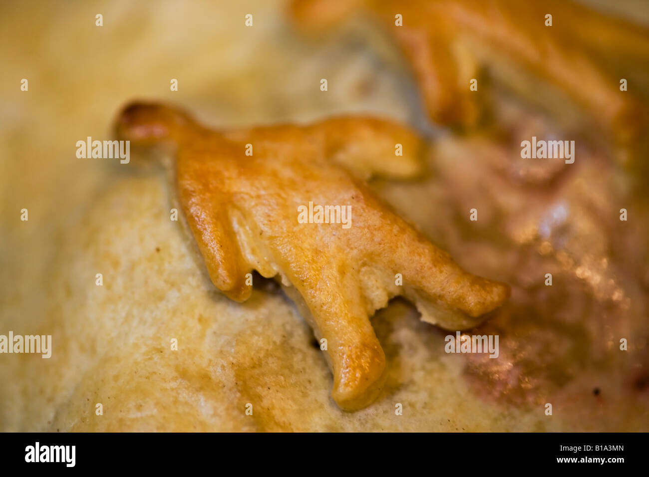 Pastry stick men figures on top of an apple pie Stock Photo - Alamy