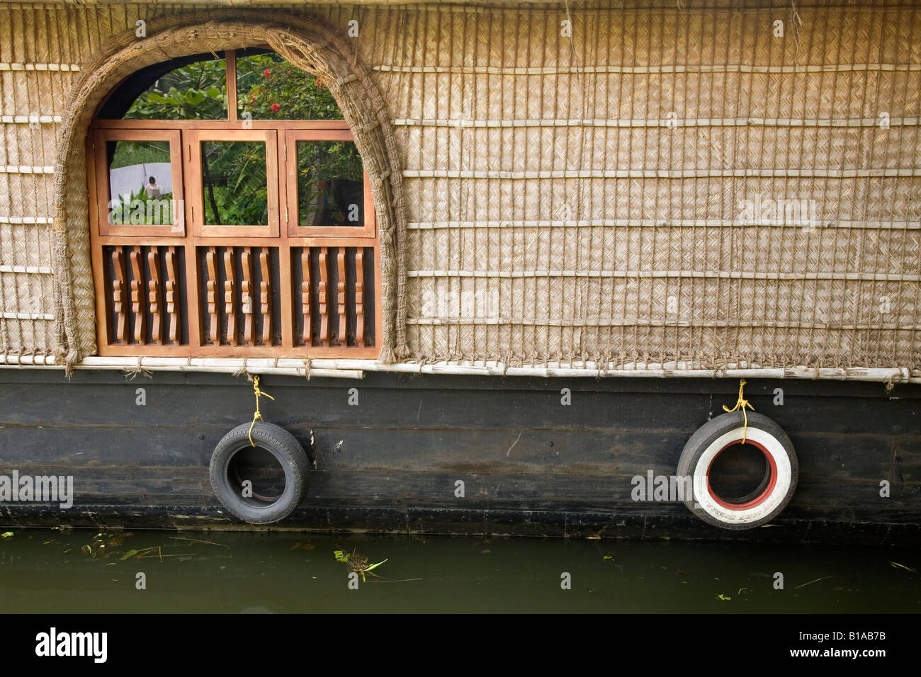 The window of a houseboat on one of the canals near to Alappuzha in ...
