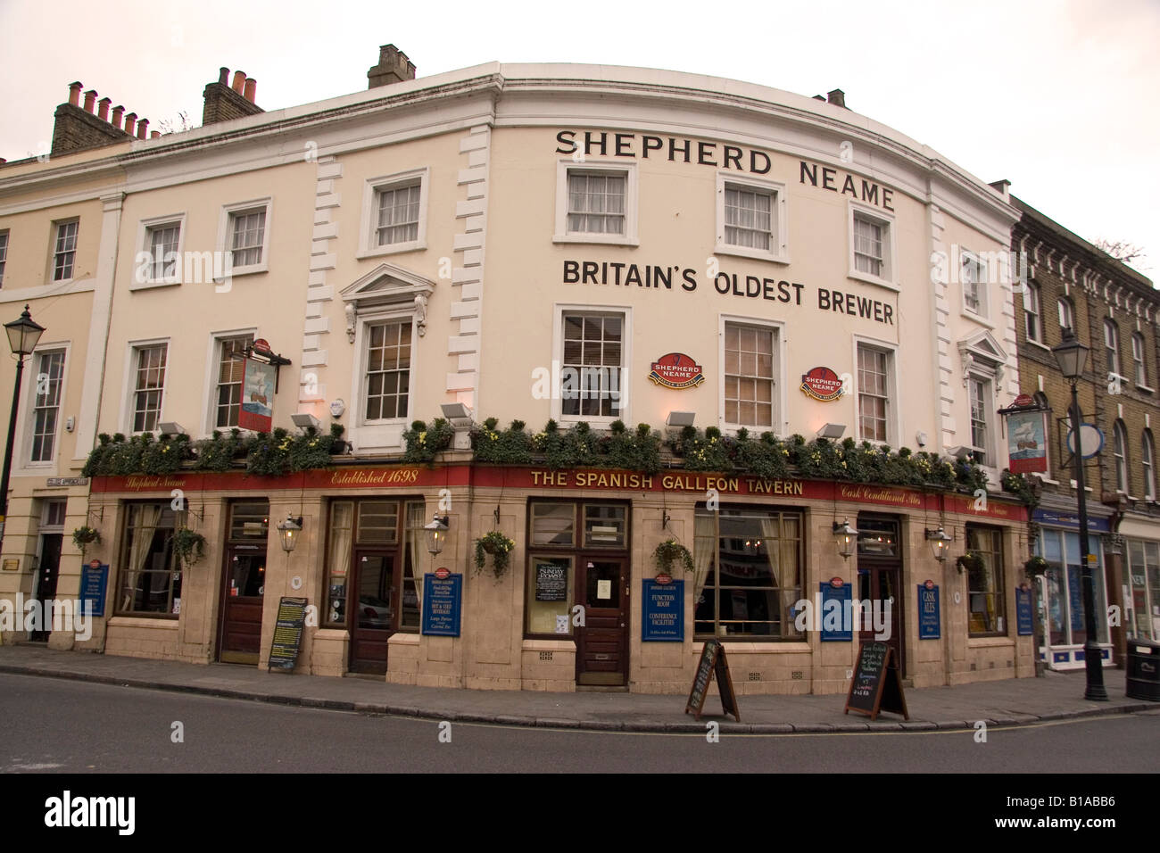 A typical British street scene from Greenwich in London. A public house ...