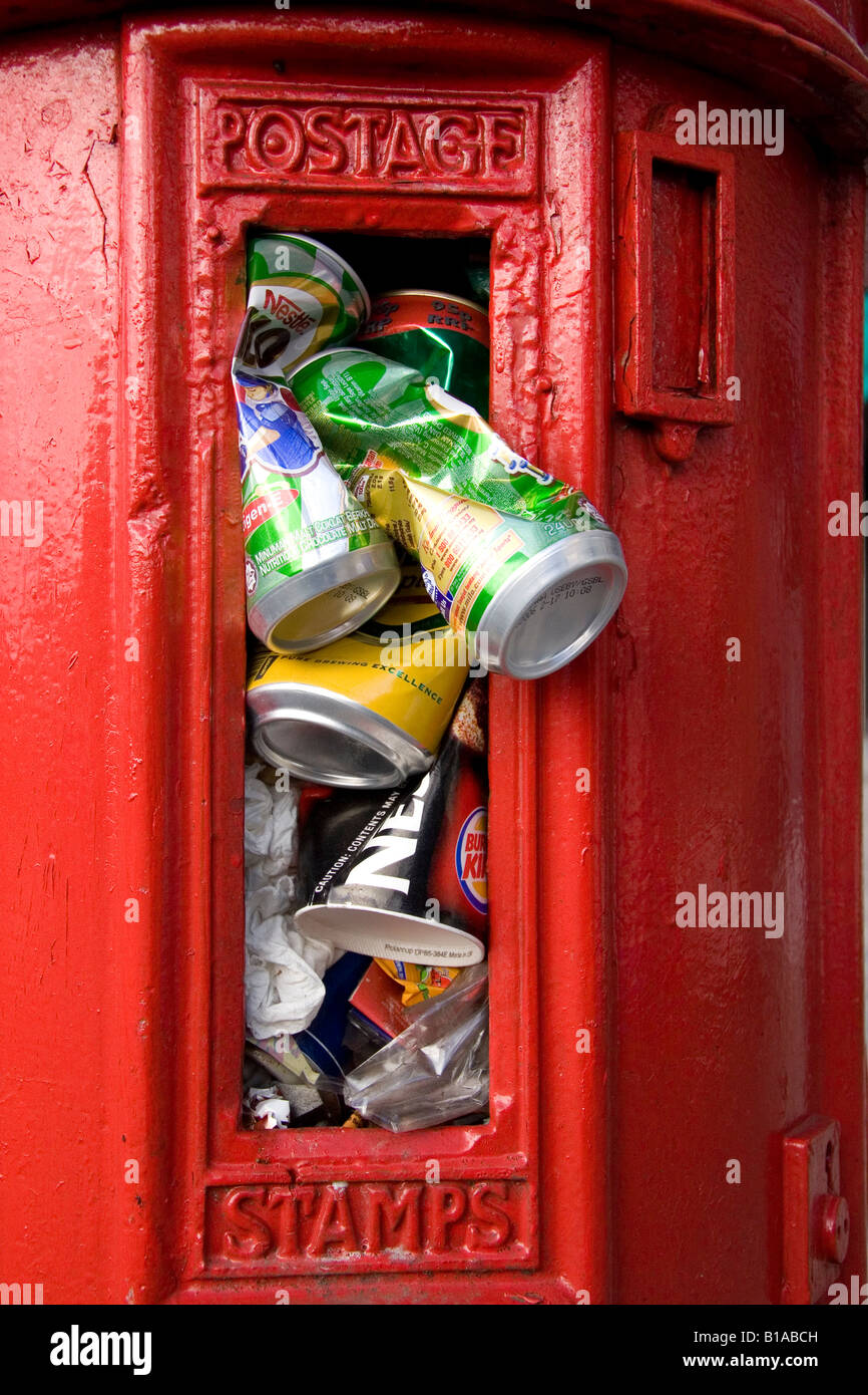 A traditional red postbox has been used as a rubbish bin in London ...