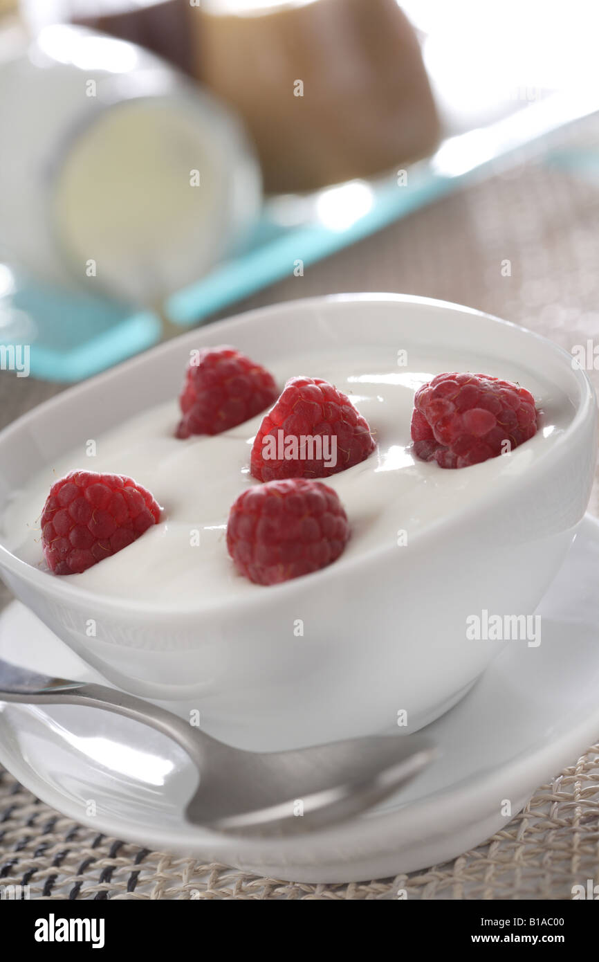 Bowl with natural yoghurt and raspberries (vertical Stock Photo - Alamy