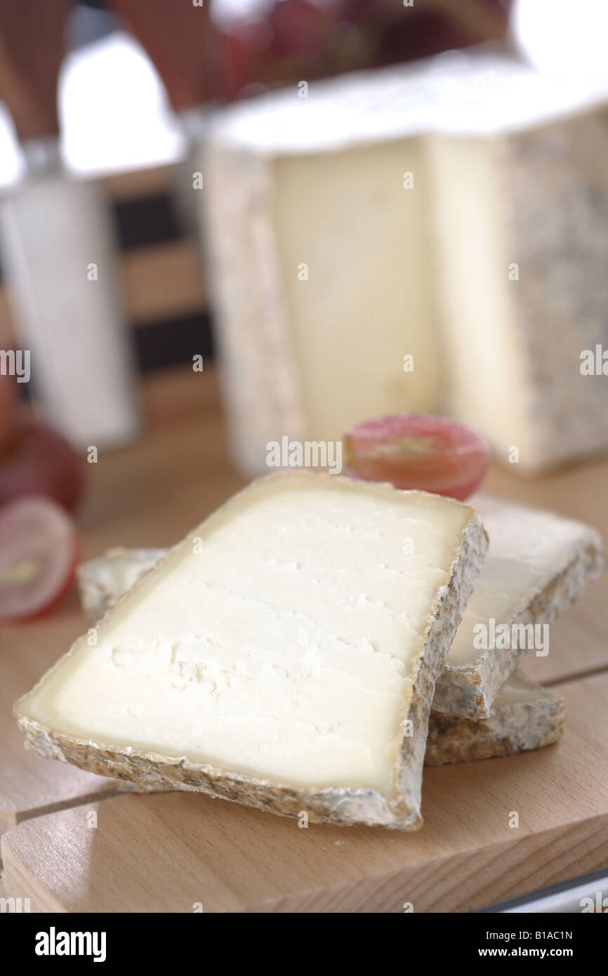 Sliced goat cheese (vertical Stock Photo - Alamy