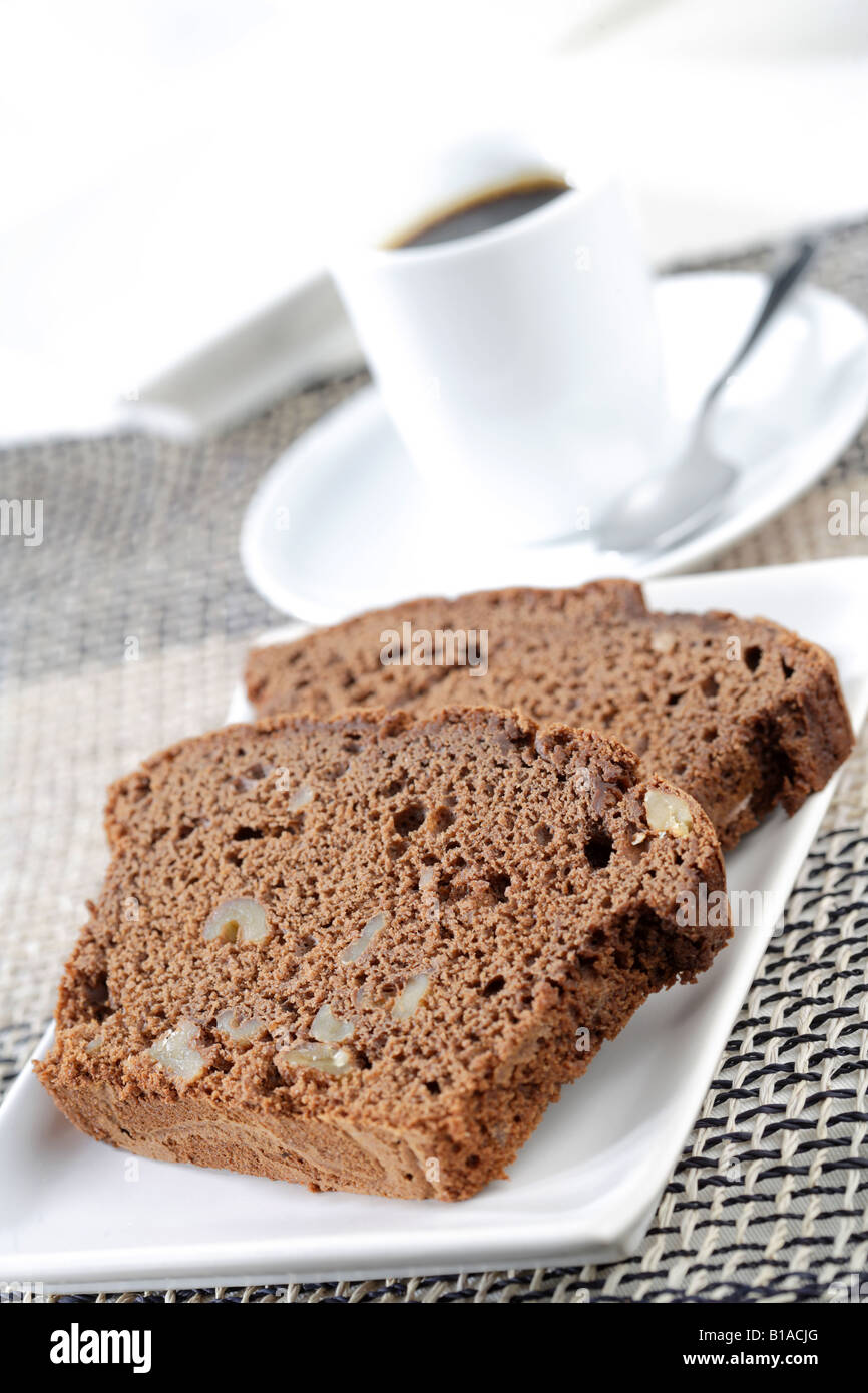 A piece of chocolate and nut sponge cake (vertical Stock Photo - Alamy