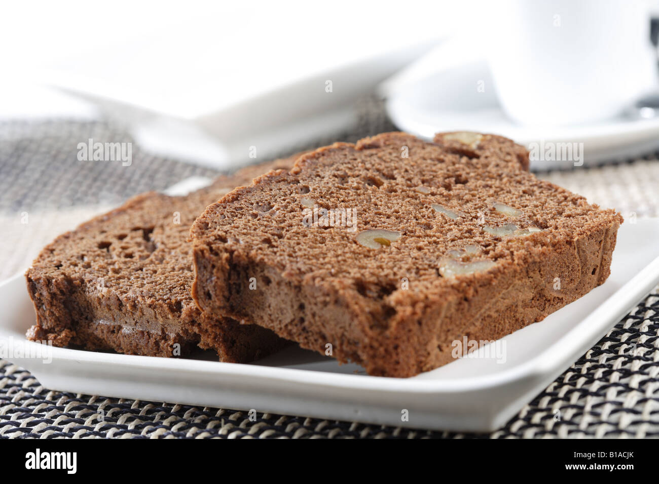 A piece of chocolate and nut sponge cake Stock Photo - Alamy