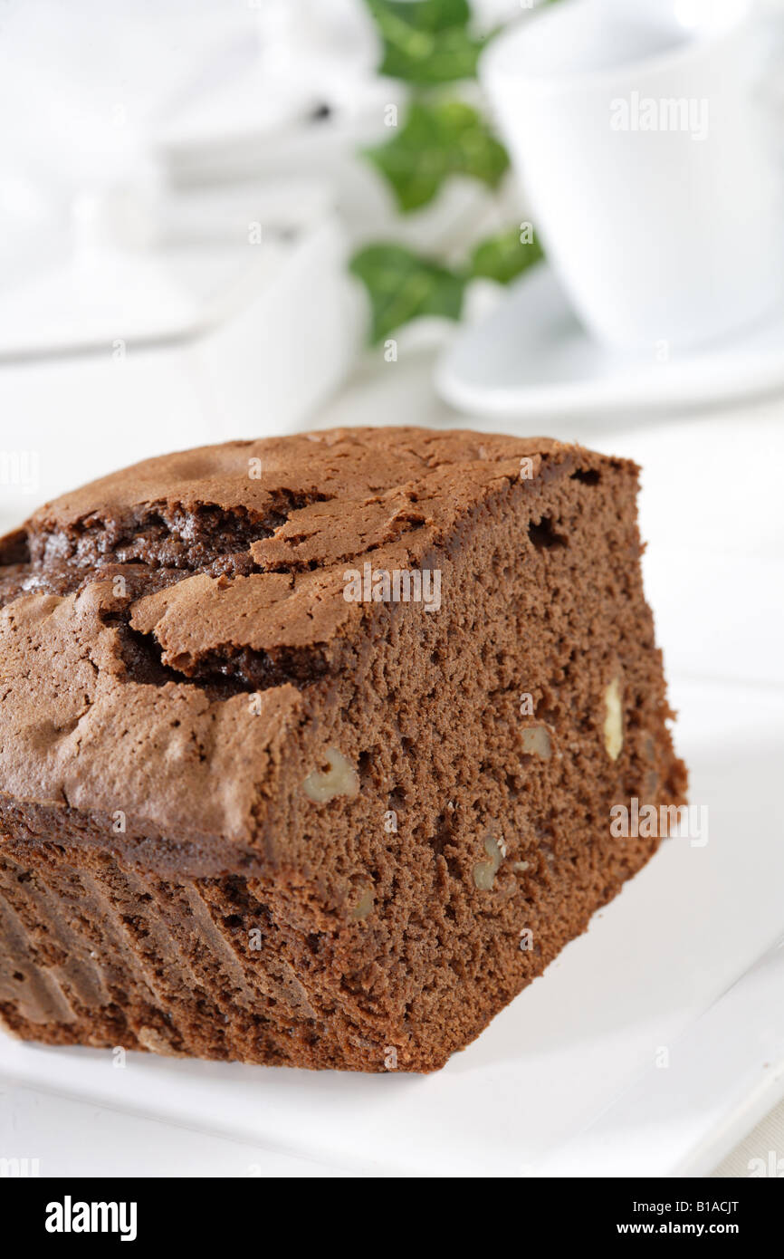 A piece of chocolate and nut sponge cake (vertical Stock Photo - Alamy