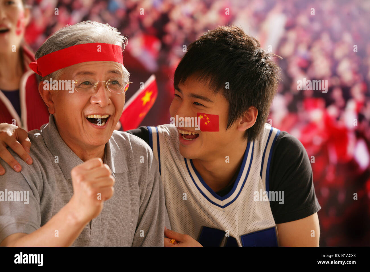 old man and boy cheering in stadium Stock Photo - Alamy