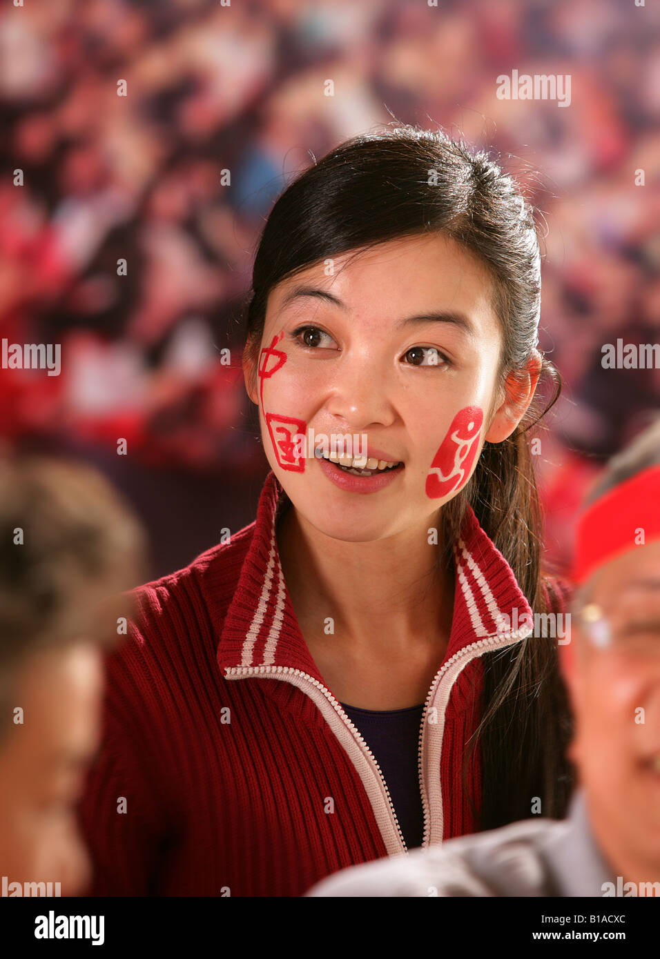 a girl cheering in stadium Stock Photo - Alamy