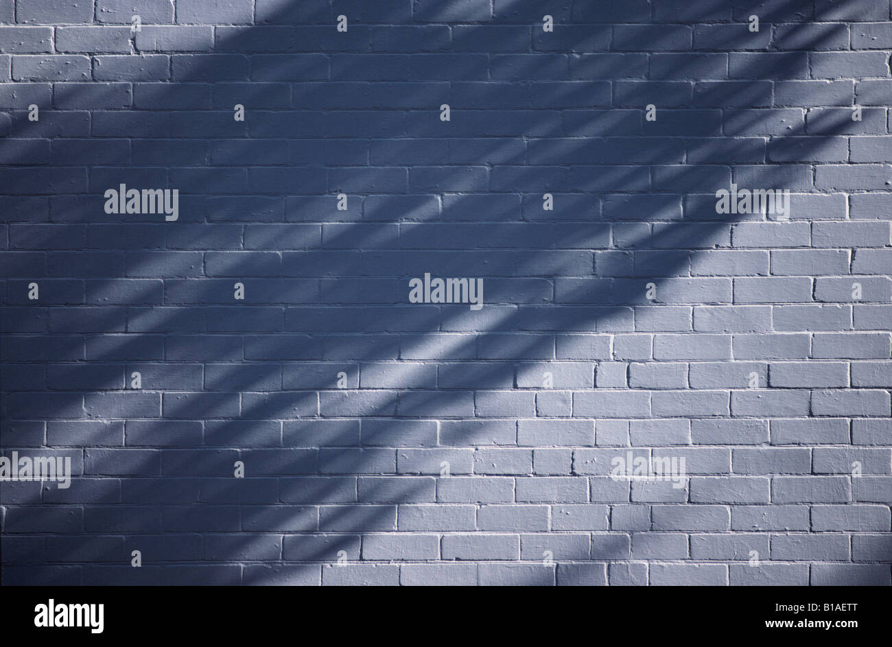 Brick Wall In Shadow Stock Photo - Alamy