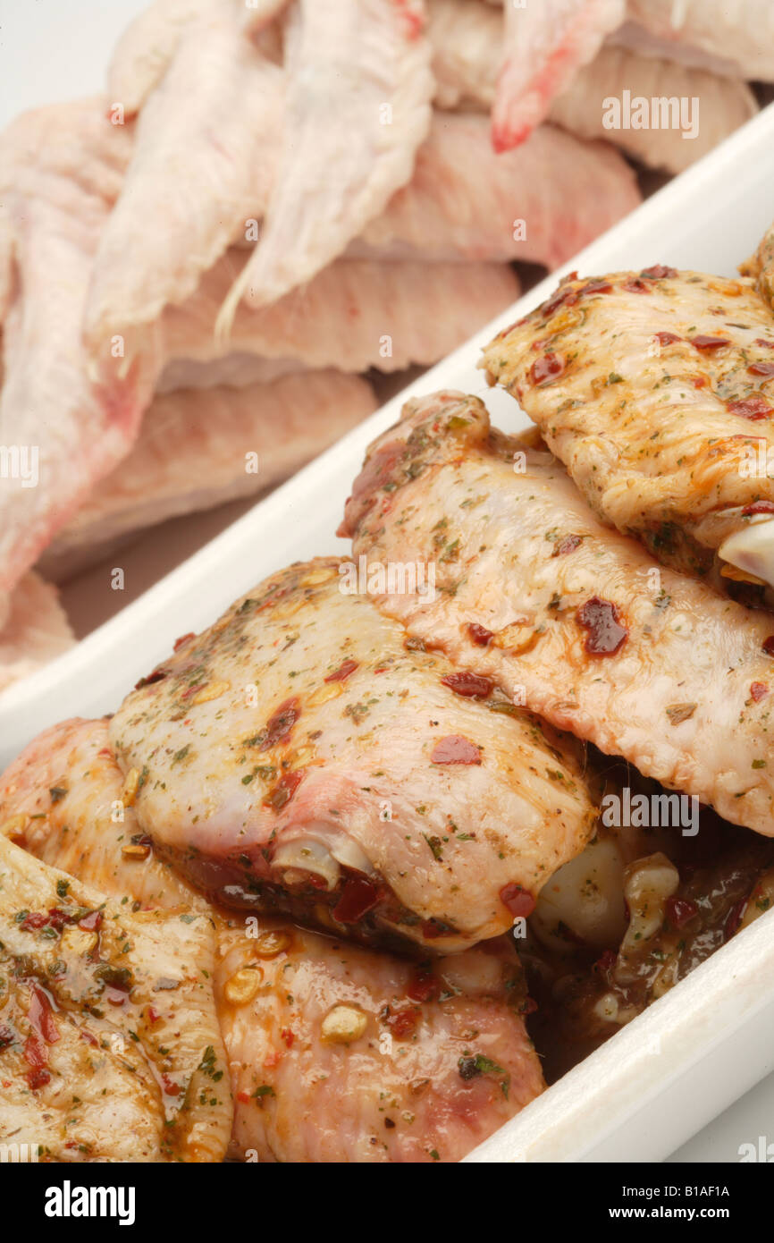Close-up of fresh pre-cooked chicken wings (vertical Stock Photo - Alamy