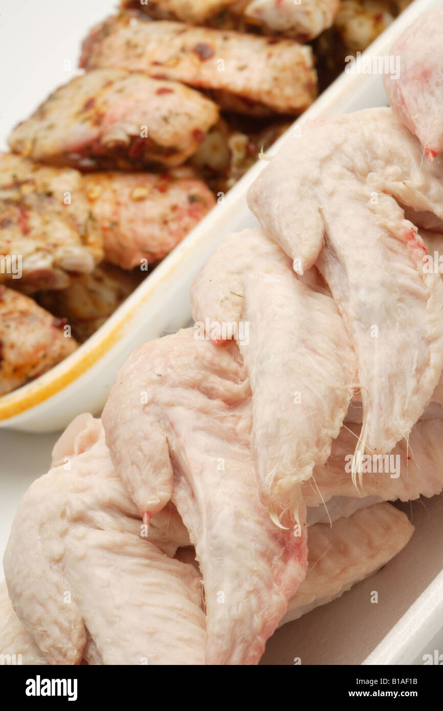Close-up of fresh pre-cooked chicken wings (vertical Stock Photo - Alamy