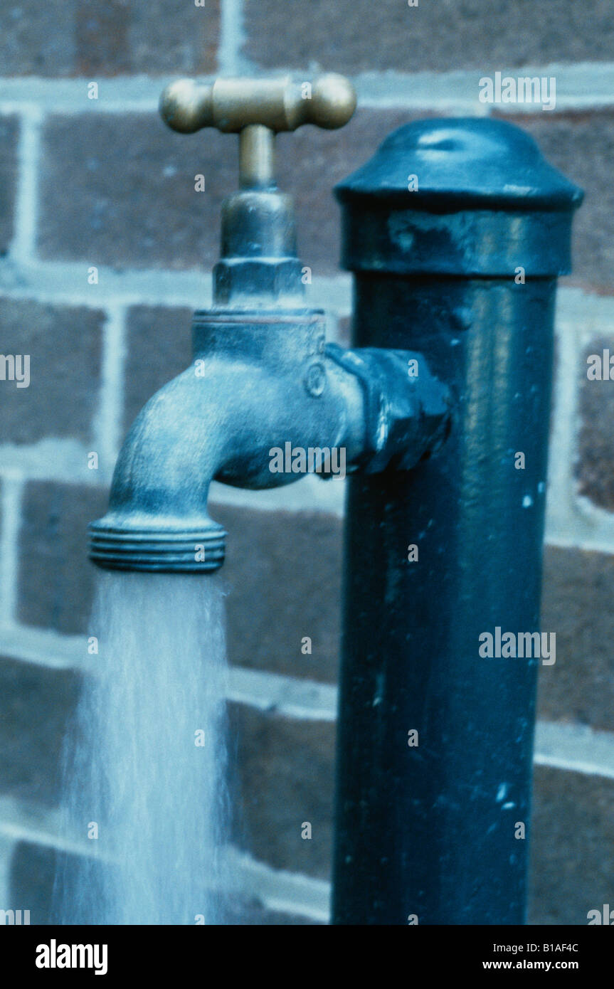 Water Flowing From Faucet Stock Photo - Alamy