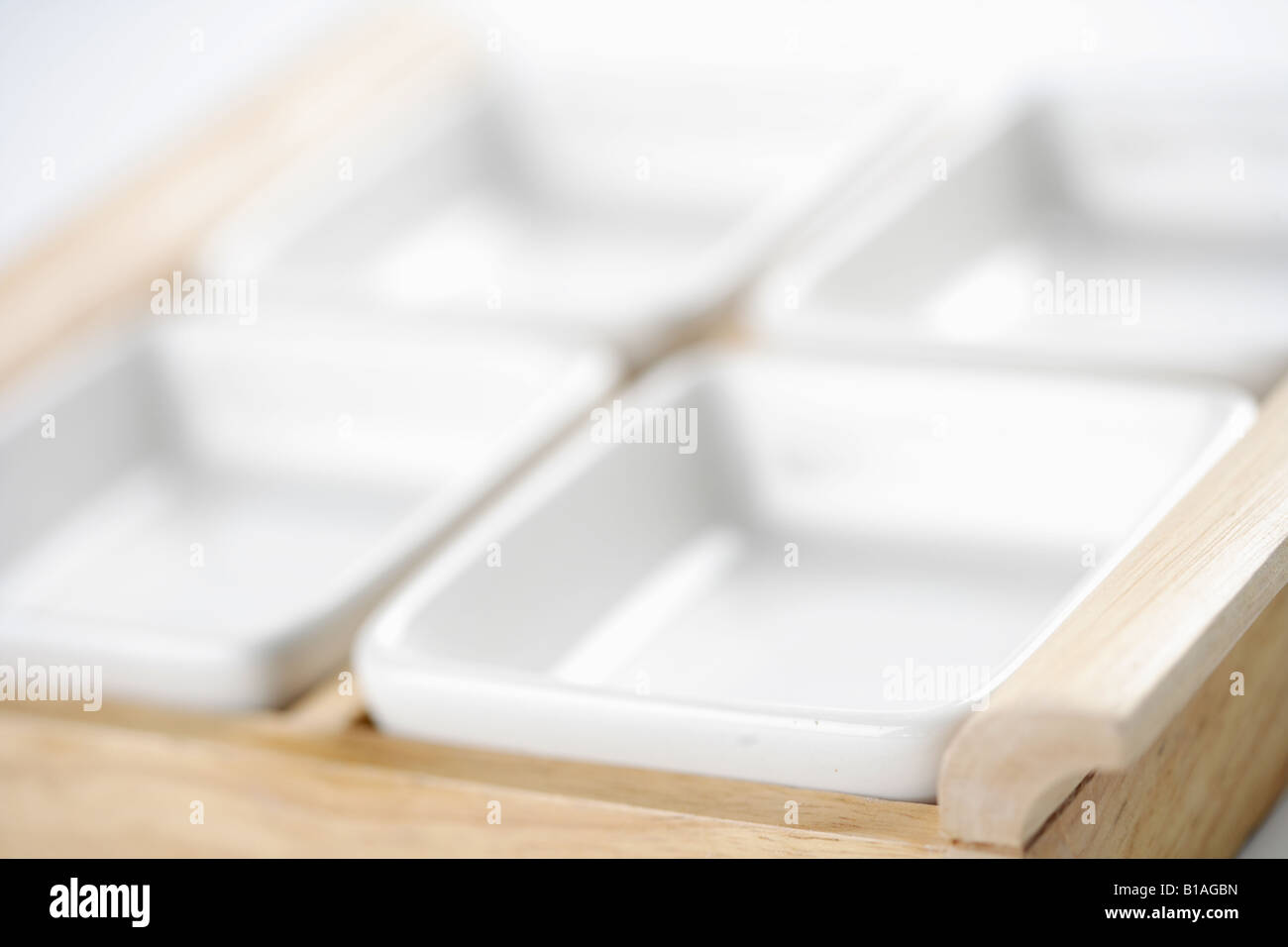 Empty appetizer square plates Stock Photo - Alamy