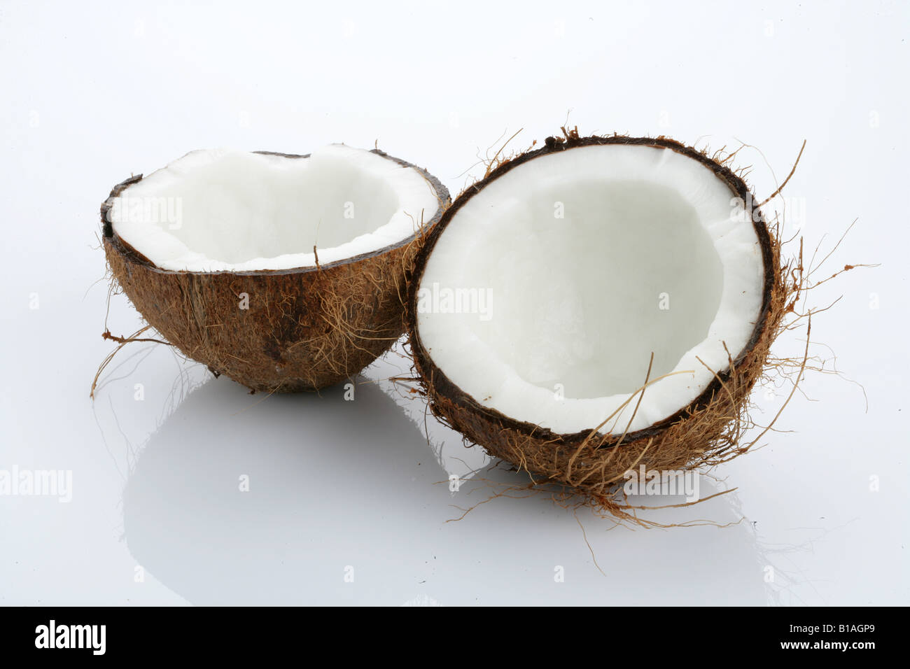 A coconut cut in half Stock Photo - Alamy