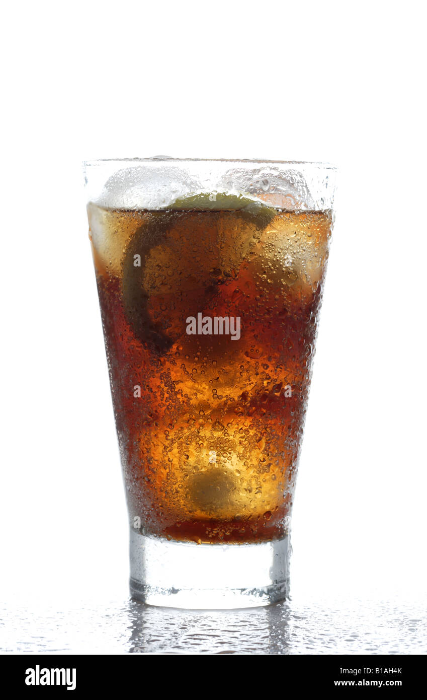 A glass of cola with ice cubes and a slice of lemon Stock Photo - Alamy