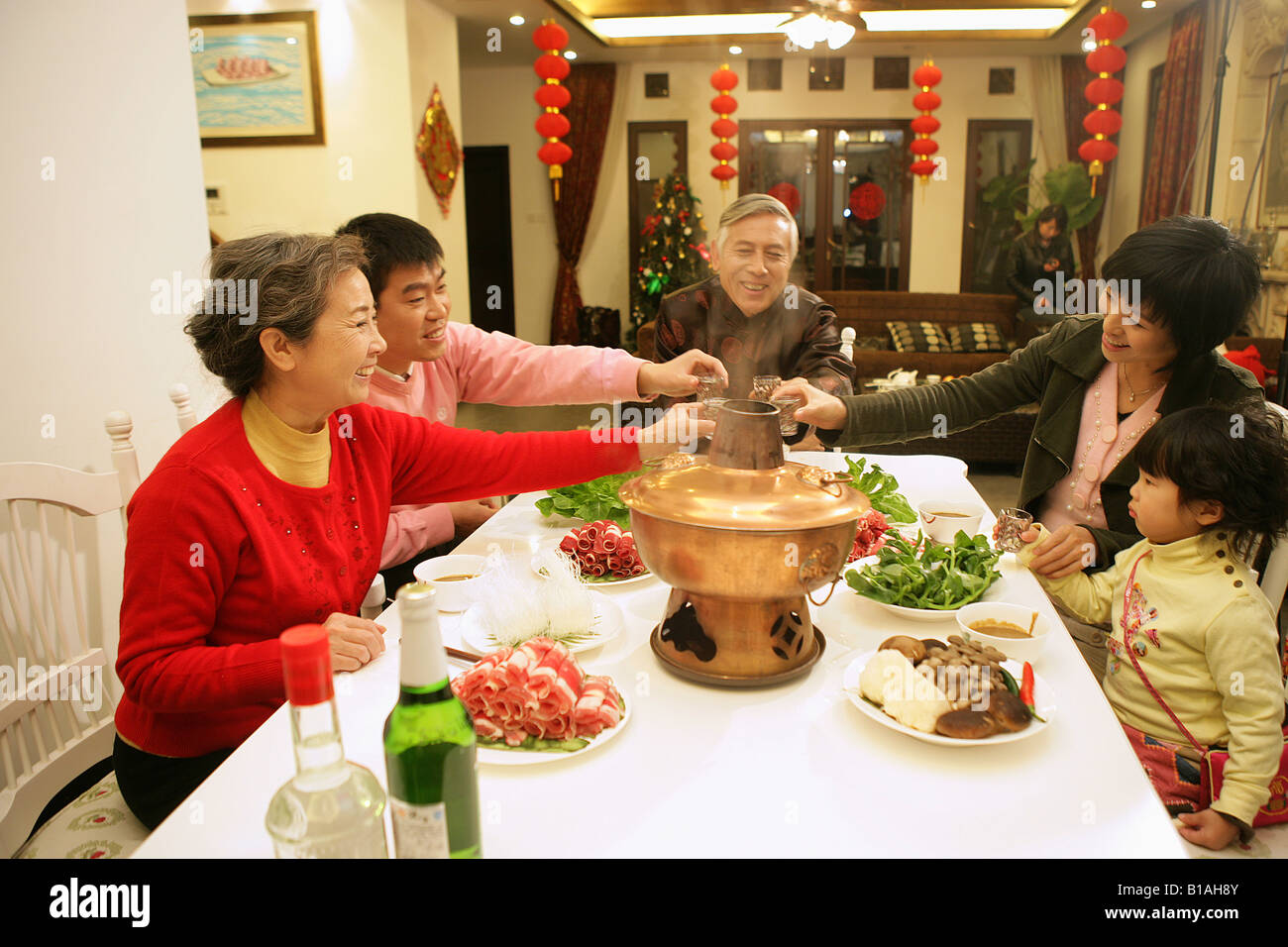 Chinese family at dinner table Stock Photo - Alamy