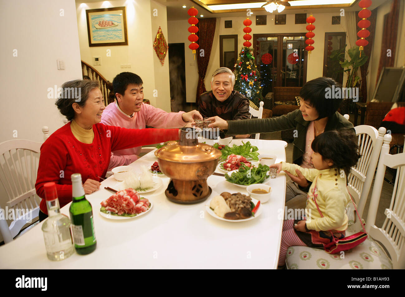 Chinese family at dinner table Stock Photo - Alamy