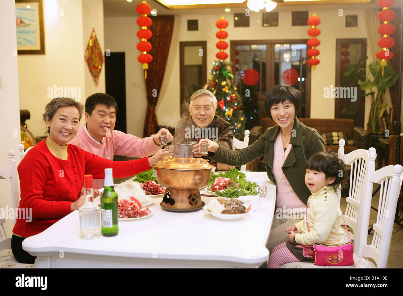 Chinese family at dinner table Stock Photo - Alamy