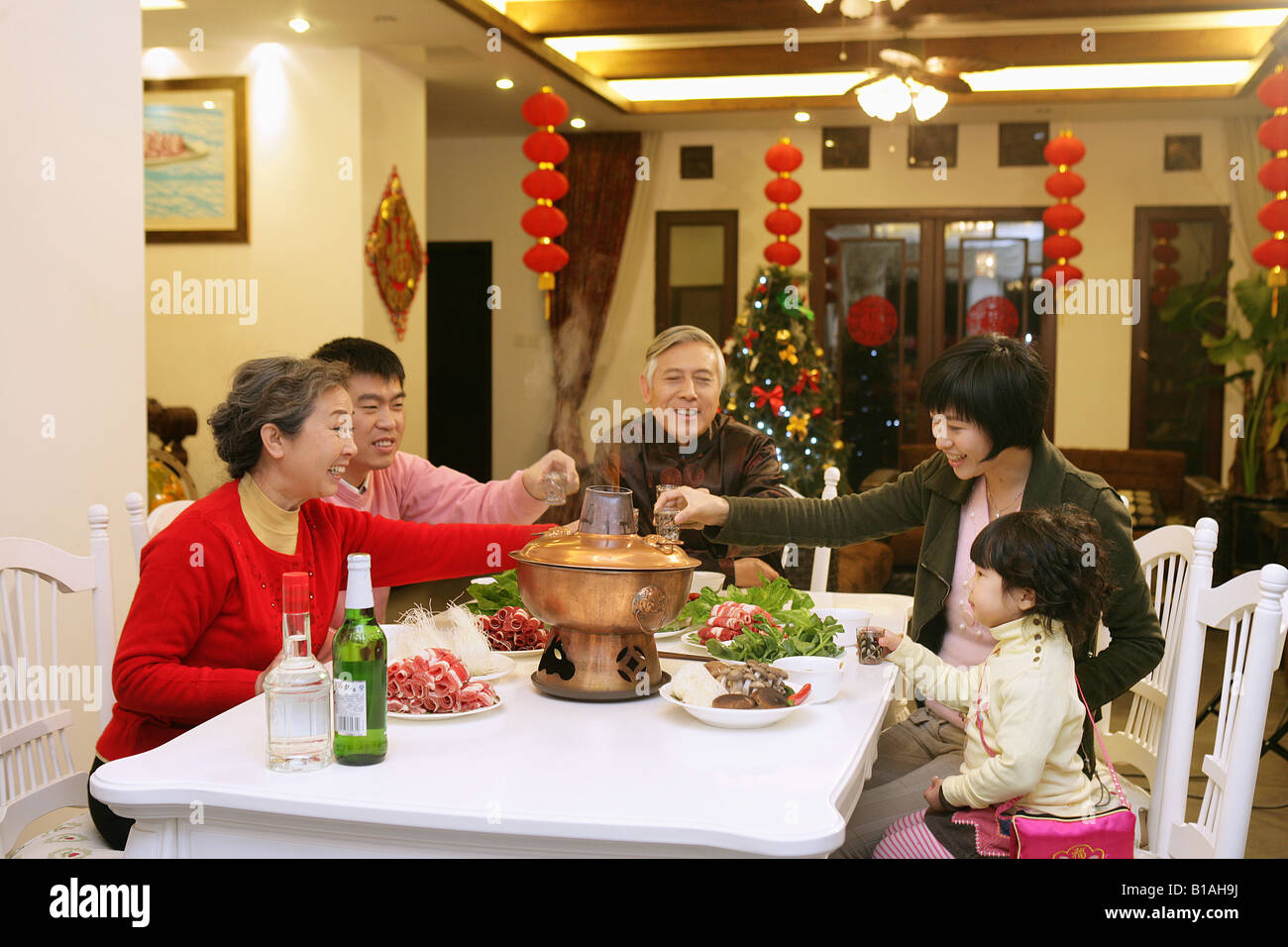 Chinese family at dinner table Stock Photo - Alamy