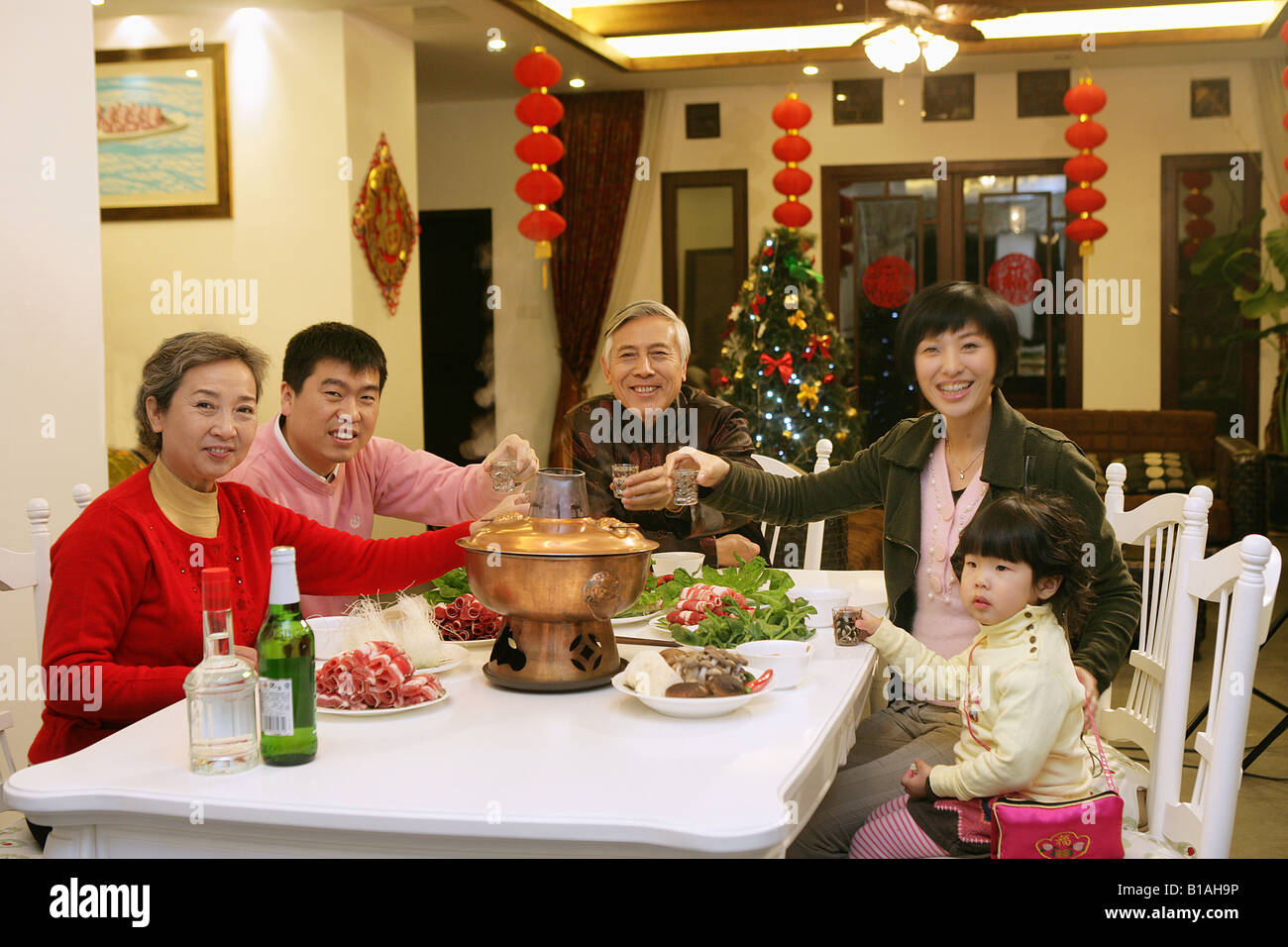 Chinese family at dinner table Stock Photo - Alamy