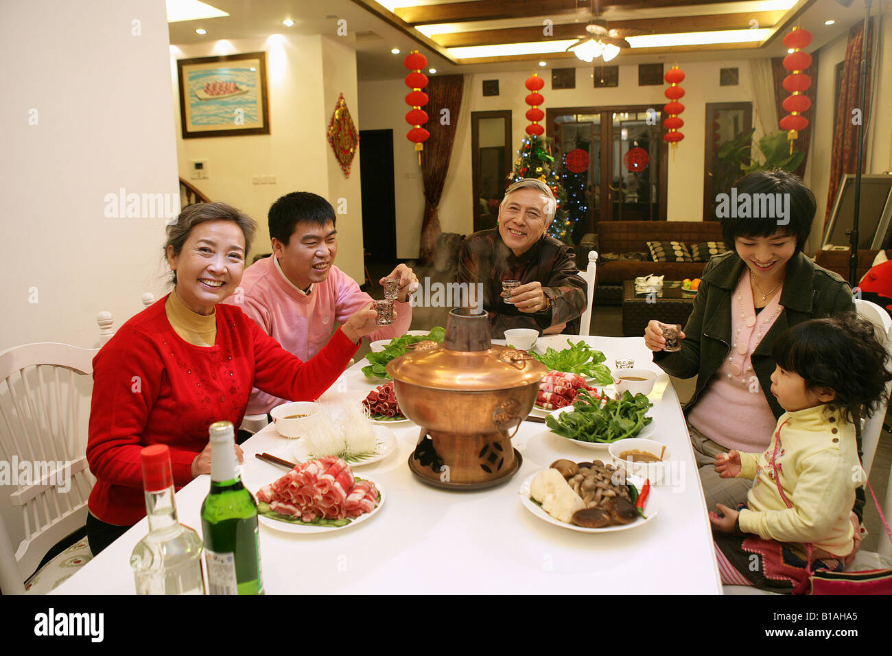 Chinese family at dinner table Stock Photo - Alamy