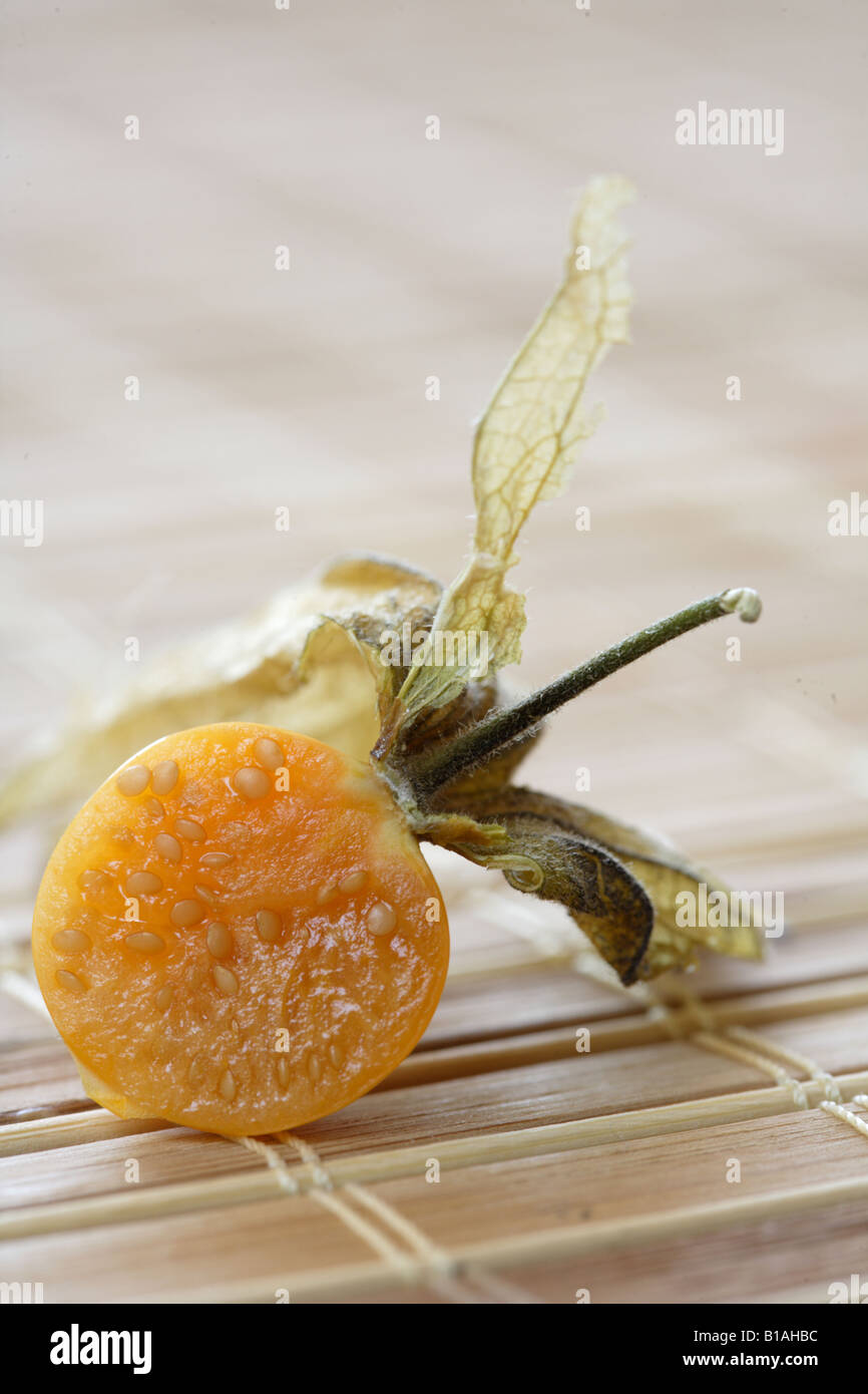 A Physalis (cape gooseberry)cut in half Stock Photo - Alamy
