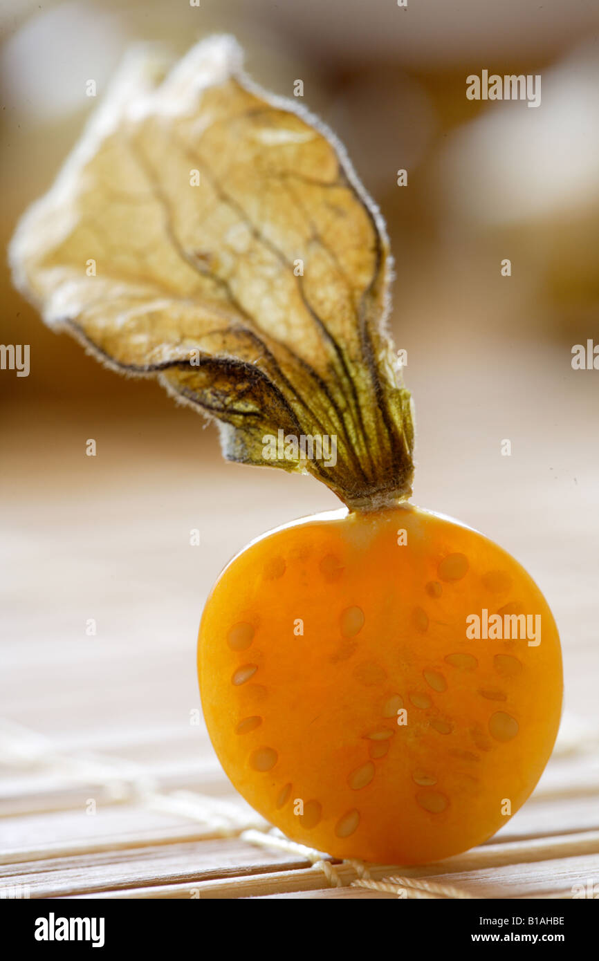 A Physalis (cape gooseberry)cut in half Stock Photo - Alamy