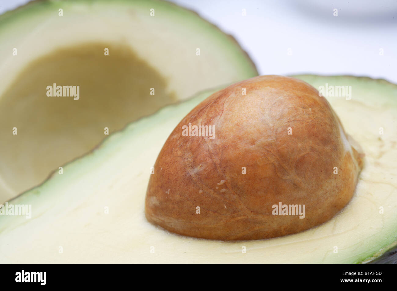 An avocado cut in half Stock Photo - Alamy