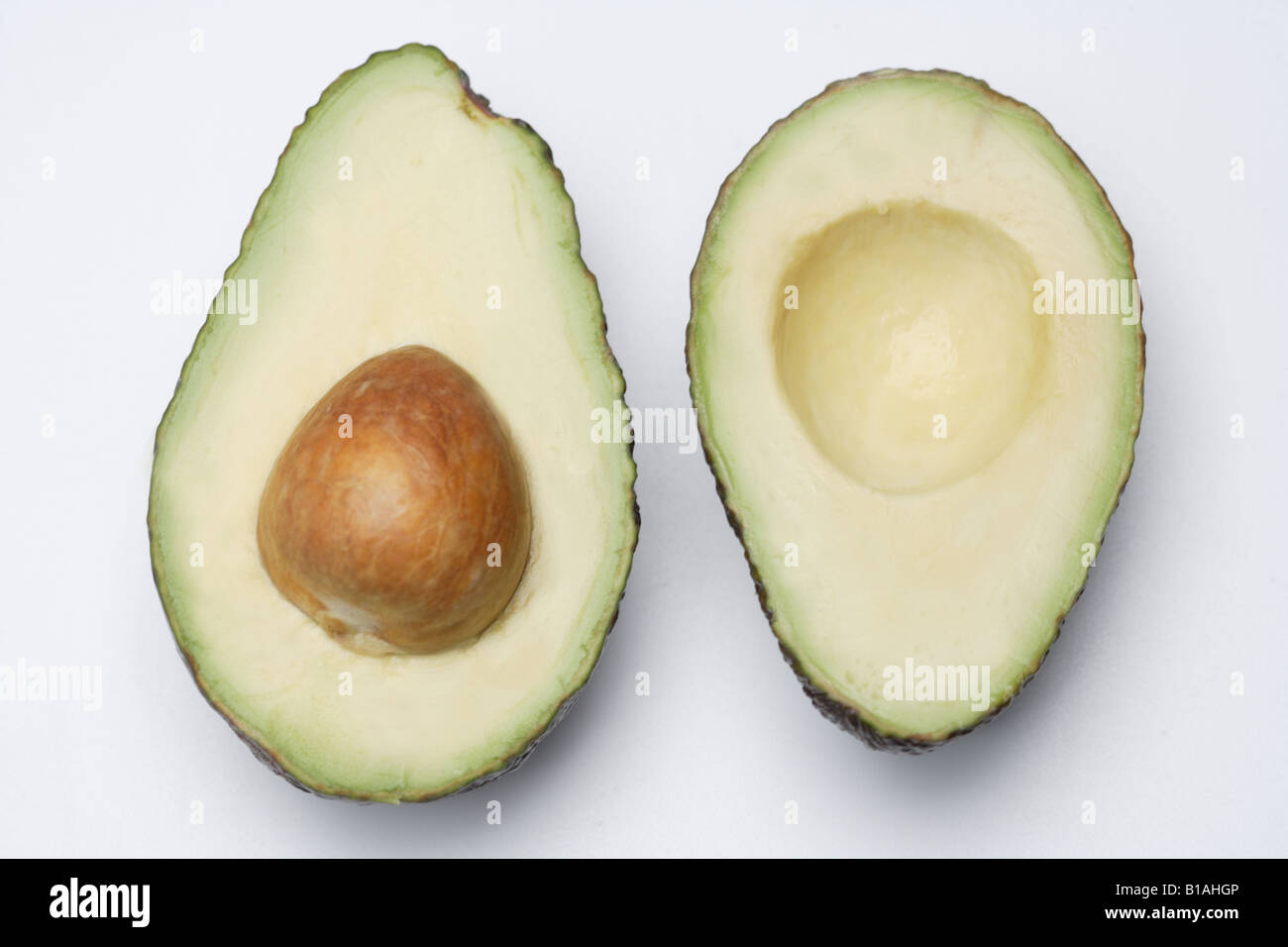 An avocado cut in half Stock Photo - Alamy