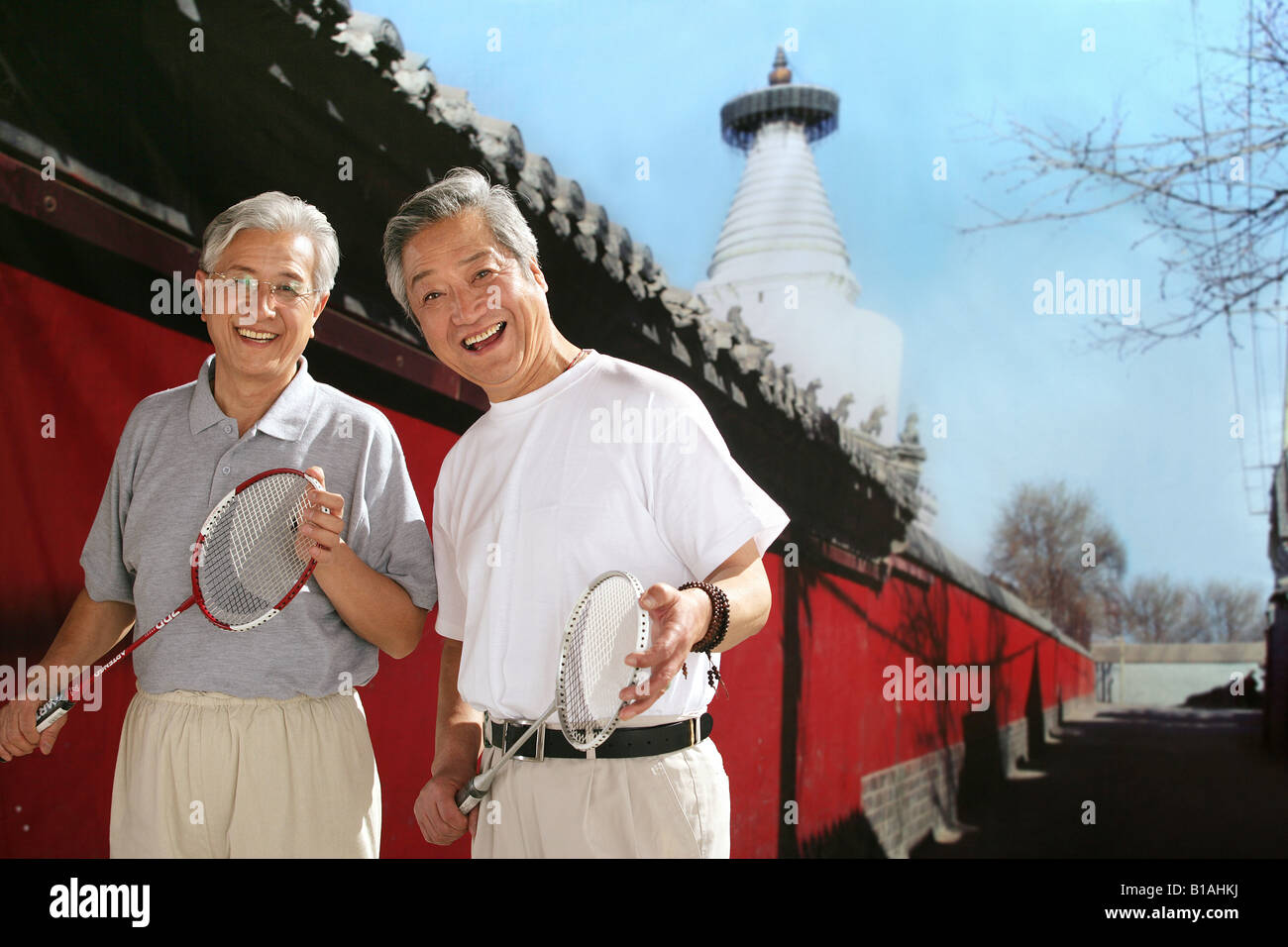 two oriental senior men playing badminton Stock Photo - Alamy