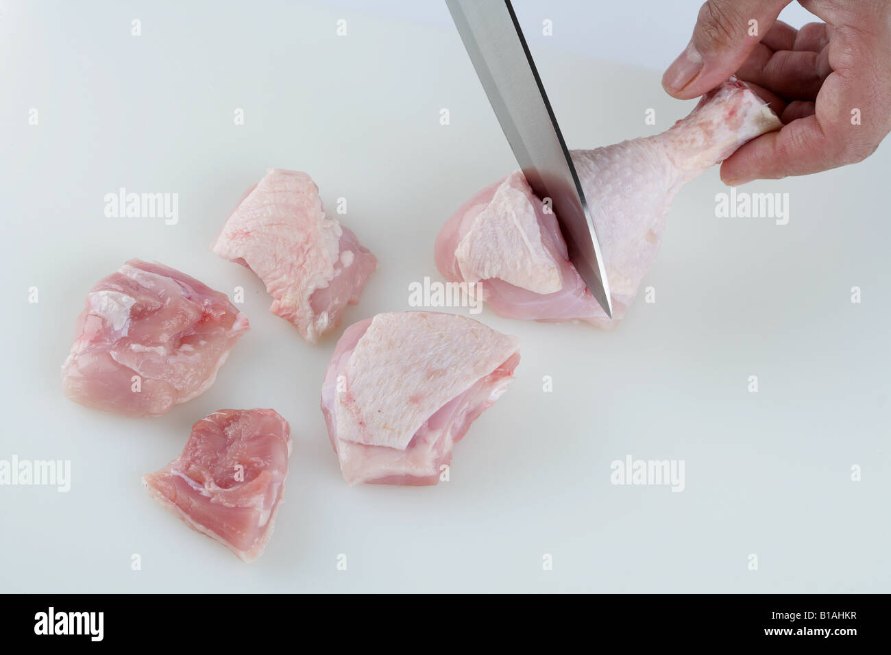 Cleaning and chopping chicken meat Stock Photo - Alamy