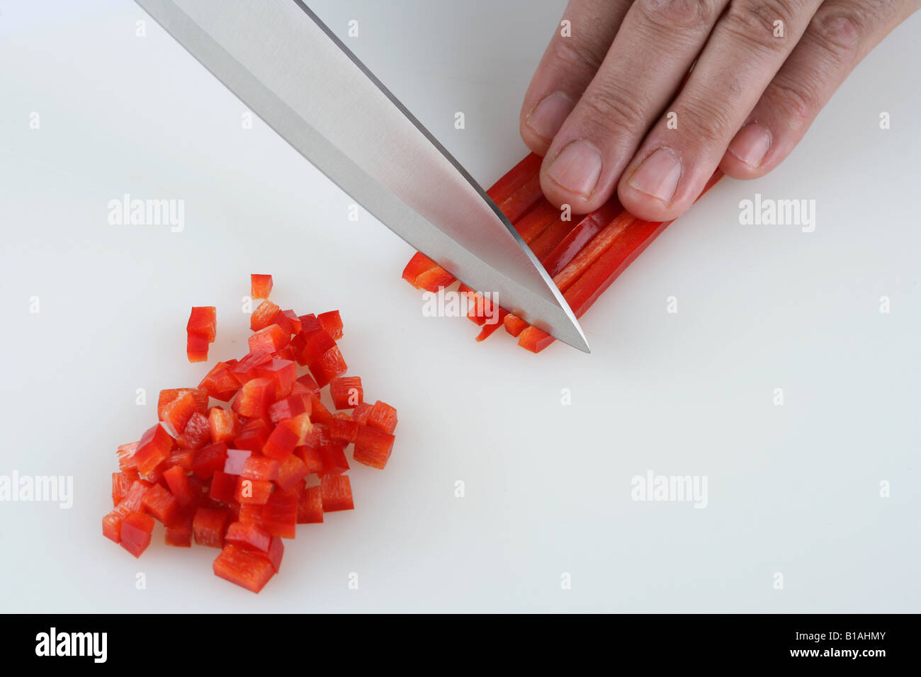 Chopping red pepper Stock Photo - Alamy